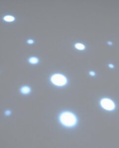 Why Are There White Dots on My Projector Screen?